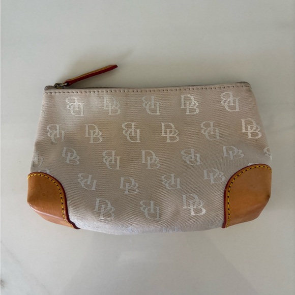 Dooney & Bourke | Bags | Dooney Bourke Cream And Tan Logo Makeup Pouch ...